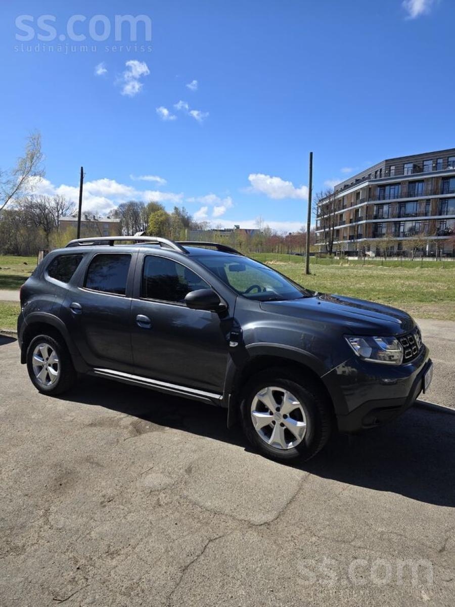 Grey Dacia Duster 2021 in Riga, with an engine capacity of 1.50 L and mileage of 128 thousand km for 12900 €, photo 1 on AUTOMOTO.COM.LV