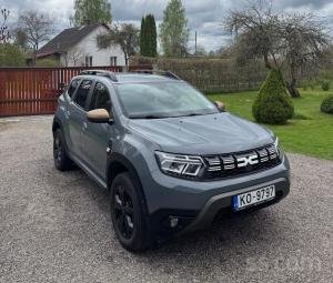 Grey Dacia Duster 2023 in Riga, with an engine capacity of 1.00 L and mileage of 56 thousand km for 15600 €, photo  on AUTOMOTO.COM.LV