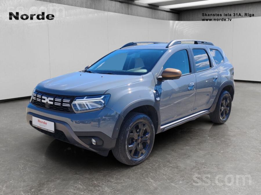 Grey Dacia Duster 2023 in Riga, with an engine capacity of 1.00 L and mileage of 57 thousand km for 14490 €, photo 1 on AUTOMOTO.COM.LV