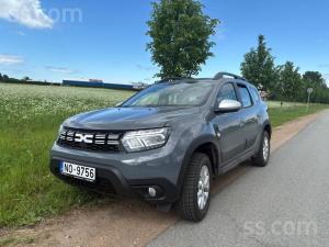 Grey Dacia Duster 2023 in Riga, with an engine capacity of 1.00 L and mileage of 16 thousand km for 15700 €, photo  on AUTOMOTO.COM.LV
