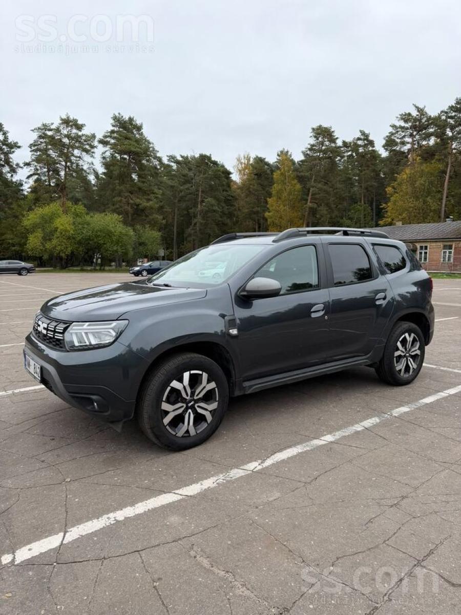Grey Dacia Duster 2023 in Riga, with an engine capacity of 1.30 L and mileage of 97 thousand km for 14700 €, photo 1 on AUTOMOTO.COM.LV