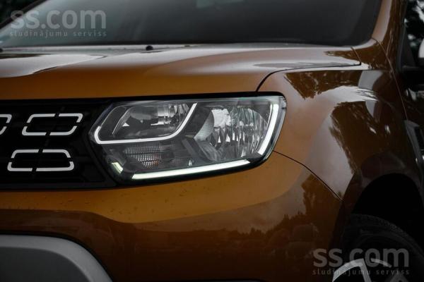 Orange Dacia Duster 2018 in Riga, with an engine capacity of 1.20 L and mileage of 96 thousand km for 11990 €, photo 5 on AUTOMOTO.COM.LV