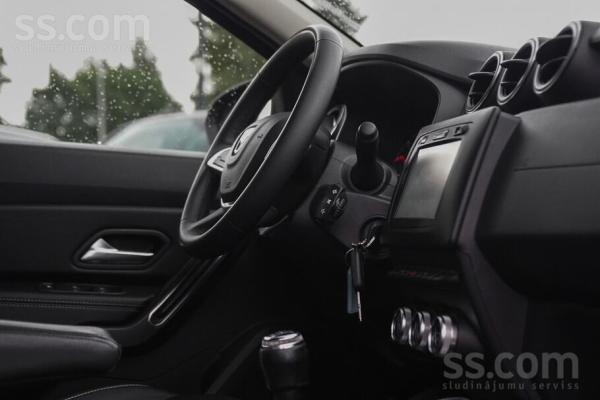 Orange Dacia Duster 2018 in Riga, with an engine capacity of 1.20 L and mileage of 96 thousand km for 11990 €, photo 9 on AUTOMOTO.COM.LV