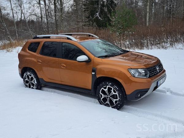Orange Dacia Duster 2019 in Riga, with an engine capacity of 1.60 L and mileage of 66 thousand km for 13500 €, photo 1 on AUTOMOTO.COM.LV