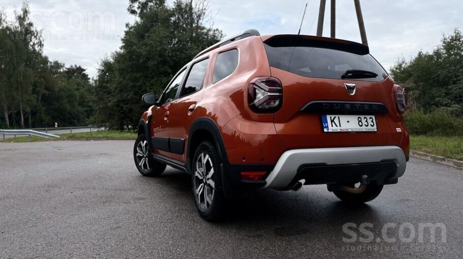 Orange Dacia Duster 2021 in Ogre, with an engine capacity of 1.00 L and mileage of 95 thousand km for 11000 €, photo 3 on AUTOMOTO.COM.LV