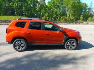 Orange Dacia Duster 2023 in Riga, with an engine capacity of 1.50 L and mileage of 75 thousand km for 18200 €, photo 5 on AUTOMOTO.COM.LV