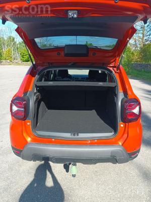 Orange Dacia Duster 2023 in Riga, with an engine capacity of 1.50 L and mileage of 75 thousand km for 18200 €, photo 6 on AUTOMOTO.COM.LV