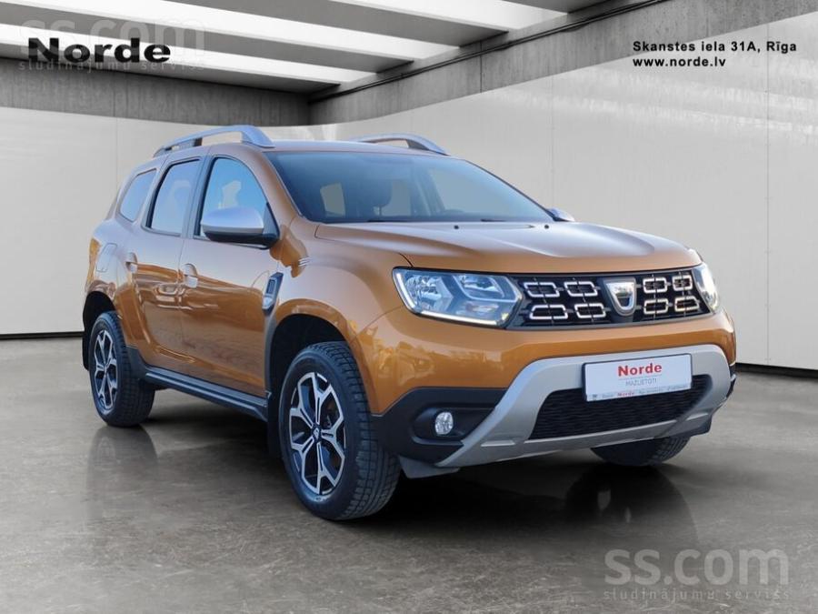 Orange Dacia Duster 2021 in Riga, with an engine capacity of 1.00 L and mileage of 81 thousand km for 10890 €, photo 4 on AUTOMOTO.COM.LV