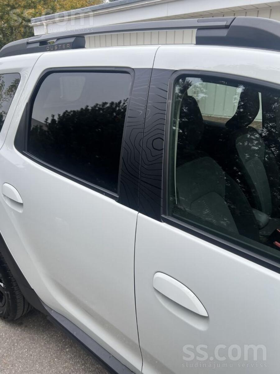 White Dacia Duster 2023 in Riga, with an engine capacity of 1.00 L and mileage of 42 thousand km for 14200 €, photo 18 on AUTOMOTO.COM.LV