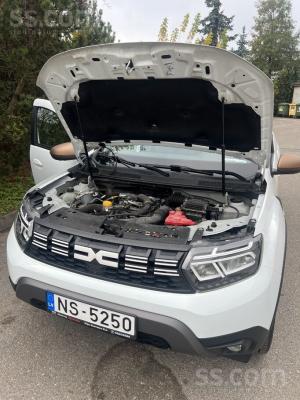 White Dacia Duster 2023 in Riga, with an engine capacity of 1.00 L and mileage of 42 thousand km for 14200 €, photo 19 on AUTOMOTO.COM.LV