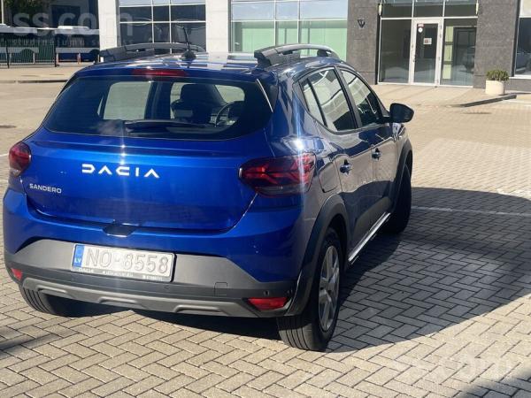 Blue Dacia Sandero 2023 in Riga, with an engine capacity of 1.00 L and mileage of 93 thousand km for 11200 €, photo 3 on AUTOMOTO.COM.LV