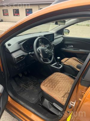 Orange Dacia Sandero 2022 in Jekabpils, with an engine capacity of 1.00 L and mileage of 55 thousand km for 11500 €, photo 9 on AUTOMOTO.COM.LV