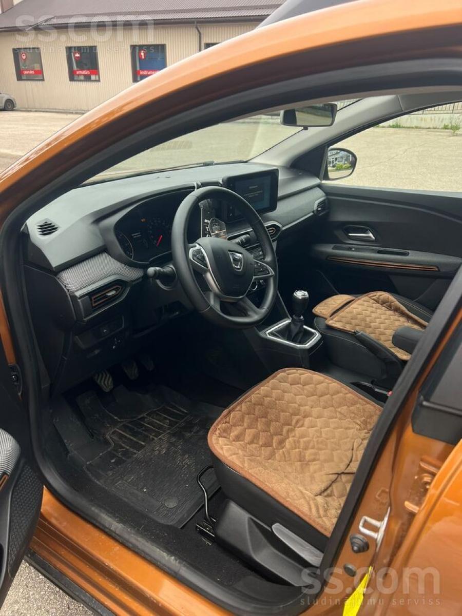 Orange Dacia Sandero 2022 in Jekabpils, with an engine capacity of 1.00 L and mileage of 55 thousand km for 11500 €, photo 9 on AUTOMOTO.COM.LV