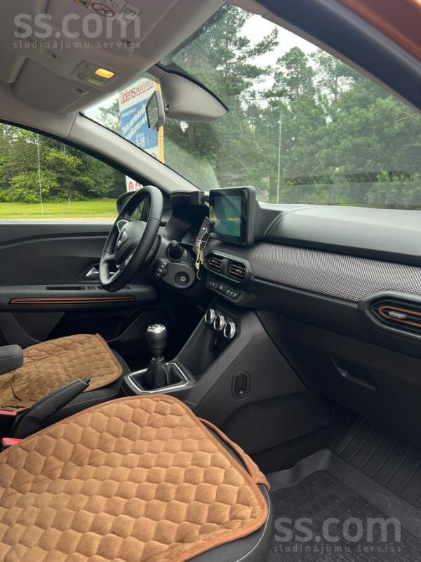 Orange Dacia Sandero 2022 in Jekabpils, with an engine capacity of 1.00 L and mileage of 55 thousand km for 11500 €, photo 9 on AUTOMOTO.COM.LV