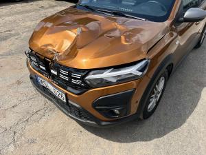 Orange Dacia Sandero 2023 in Kaunas, with an engine capacity of 1.00 L and mileage of 12 thousand km for 6900 €, photo 6 on AUTOMOTO.COM.LV