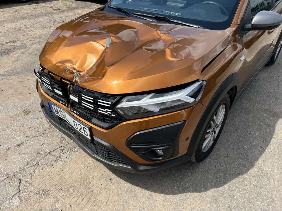 Orange Dacia Sandero 2023 in Kaunas, with an engine capacity of 1.00 L and mileage of 12 thousand km for 6900 €, photo 6 on AUTOMOTO.COM.LV