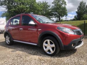 Red Dacia Sandero 2012 in Valmiera, with an engine capacity of 1.60 L and mileage of 204 thousand km for 4290 €, photo 3 on AUTOMOTO.COM.LV