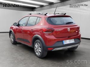 Red Dacia Sandero 2021 in Riga, with an engine capacity of 1.00 L and mileage of 54 thousand km for 10950 €, photo 3 on AUTOMOTO.COM.LV