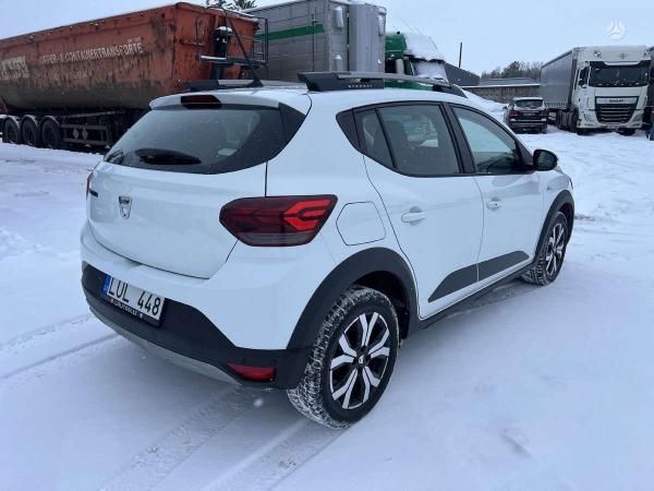 White Dacia Sandero 2021 in Kaunas, with an engine capacity of 1.00 L and mileage of 100 thousand km for 7900 €, photo 5 on AUTOMOTO.COM.LV