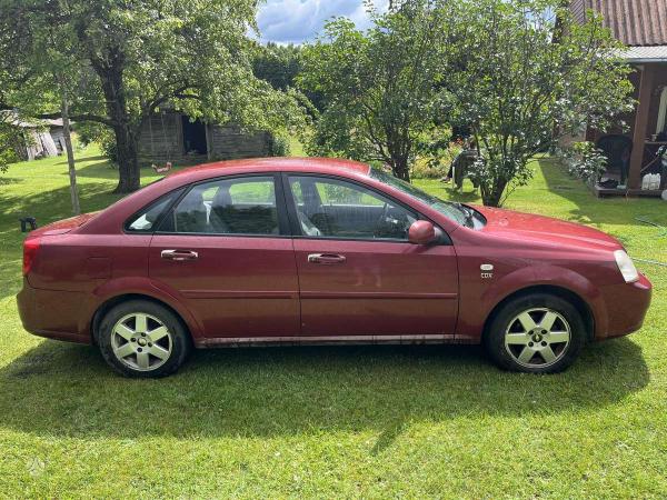 Sarkans Daewoo Nubira 2006 Viļņa, ar dzinēja tilpumu 1.80 L un nobraukumu 182 tūkst. km par 650 €, foto 6 vietnē AUTOMOTO.COM.LV