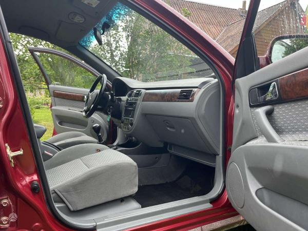 Sarkans Daewoo Nubira 2006 Viļņa, ar dzinēja tilpumu 1.80 L un nobraukumu 182 tūkst. km par 650 €, foto 9 vietnē AUTOMOTO.COM.LV