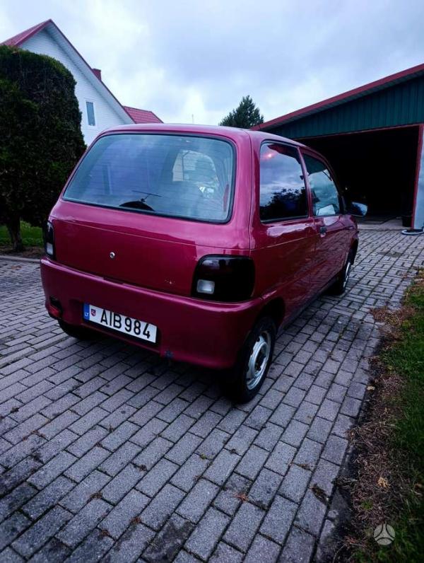 Red Daihatsu Cuore 1996 in Klaipeda, with an engine capacity of 0.85 L and mileage of 200 thousand km for 4500 €, photo 3 on AUTOMOTO.COM.LV