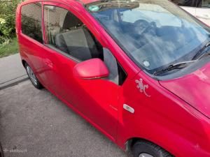 Red Daihatsu Cuore 2006 in Klaipeda, with an engine capacity of 1.00 L and mileage of 160 thousand km for 900 €, photo  on AUTOMOTO.COM.LV