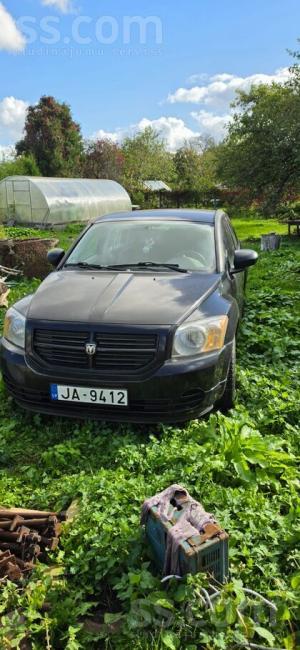 Black Dodge Caliber 2009 in Valmiera, with an engine capacity of 1.80 L and mileage of 210 thousand km for 700 €, photo 1 on AUTOMOTO.COM.LV