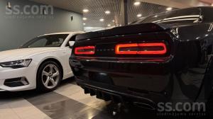 Black Dodge Challenger 2018 in Riga, with an engine capacity of 3.60 L and mileage of 130 thousand km for 18990 €, photo 19 on AUTOMOTO.COM.LV