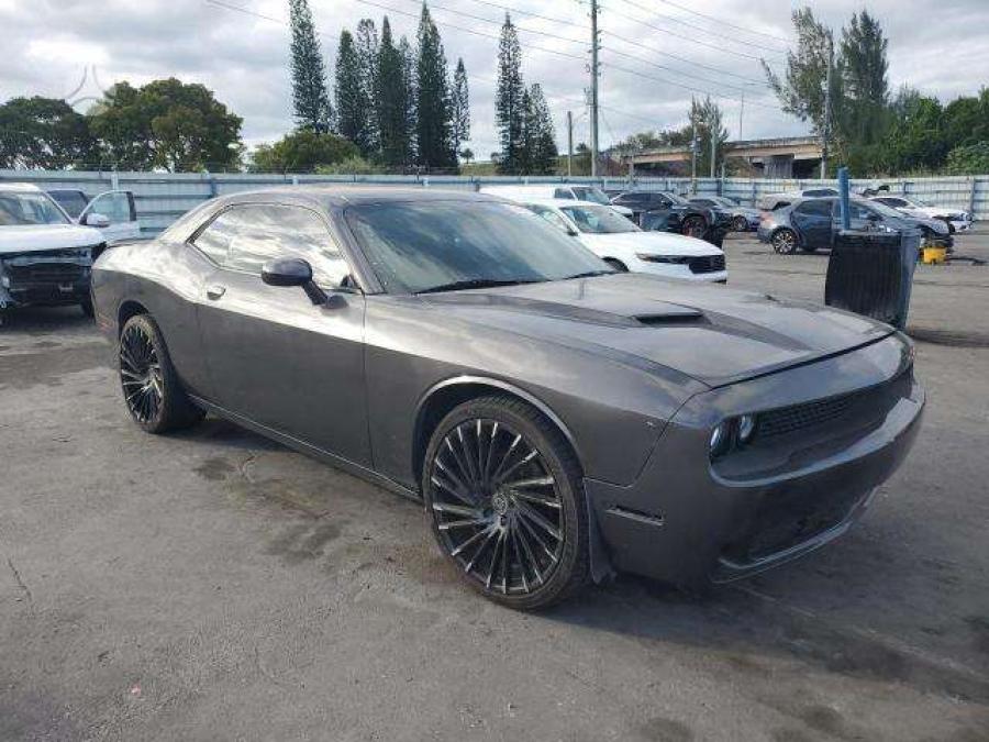 Brown Dodge Challenger 2017 in Siauliai, with an engine capacity of 3.60 L and mileage of 145 thousand km for 9650 €, photo 1 on AUTOMOTO.COM.LV