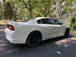 White Dodge Charger 2015 in Tallinn, with an engine capacity of 5.65 L and mileage of 196 thousand km for 11999 €, photo 8 on AUTOMOTO.COM.LV