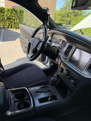 White Dodge Charger 2015 in Tallinn, with an engine capacity of 5.65 L and mileage of 196 thousand km for 11999 €, photo 23 on AUTOMOTO.COM.LV
