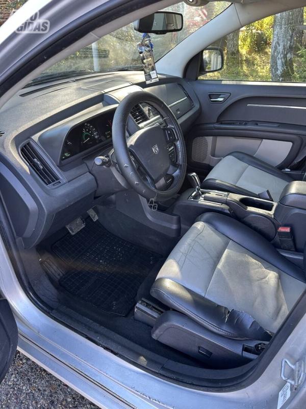 Dodge Journey 2009 Šakiai vietnē Pelēks Dodge Journey 2009 Šakiai, ar dzinēja tilpumu 2.00 L un nobraukumu 392 tūkst. km par 1000 €, foto 11 vietnē AUTOMOTO.COM.LV