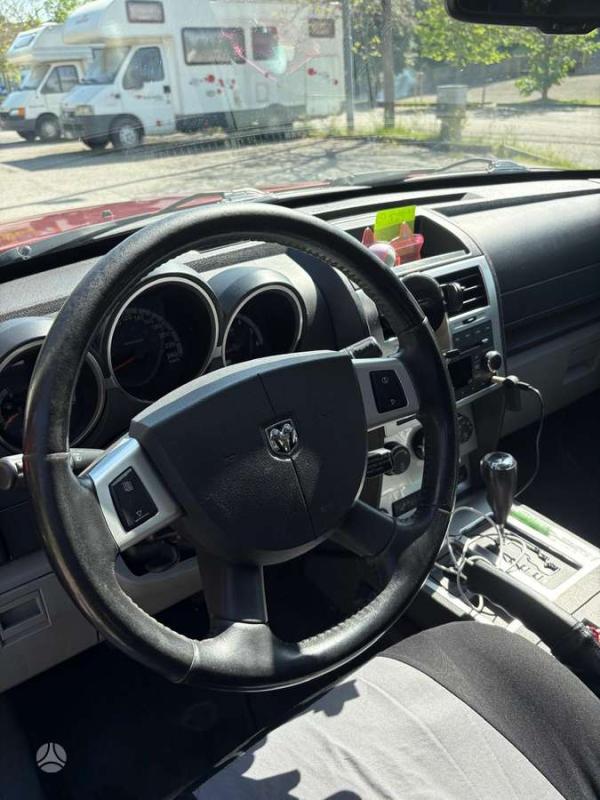 Red Dodge Nitro 2007 in Siauliai, with an engine capacity of 2.77 L and mileage of 270 thousand km for 3900 €, photo 5 on AUTOMOTO.COM.LV