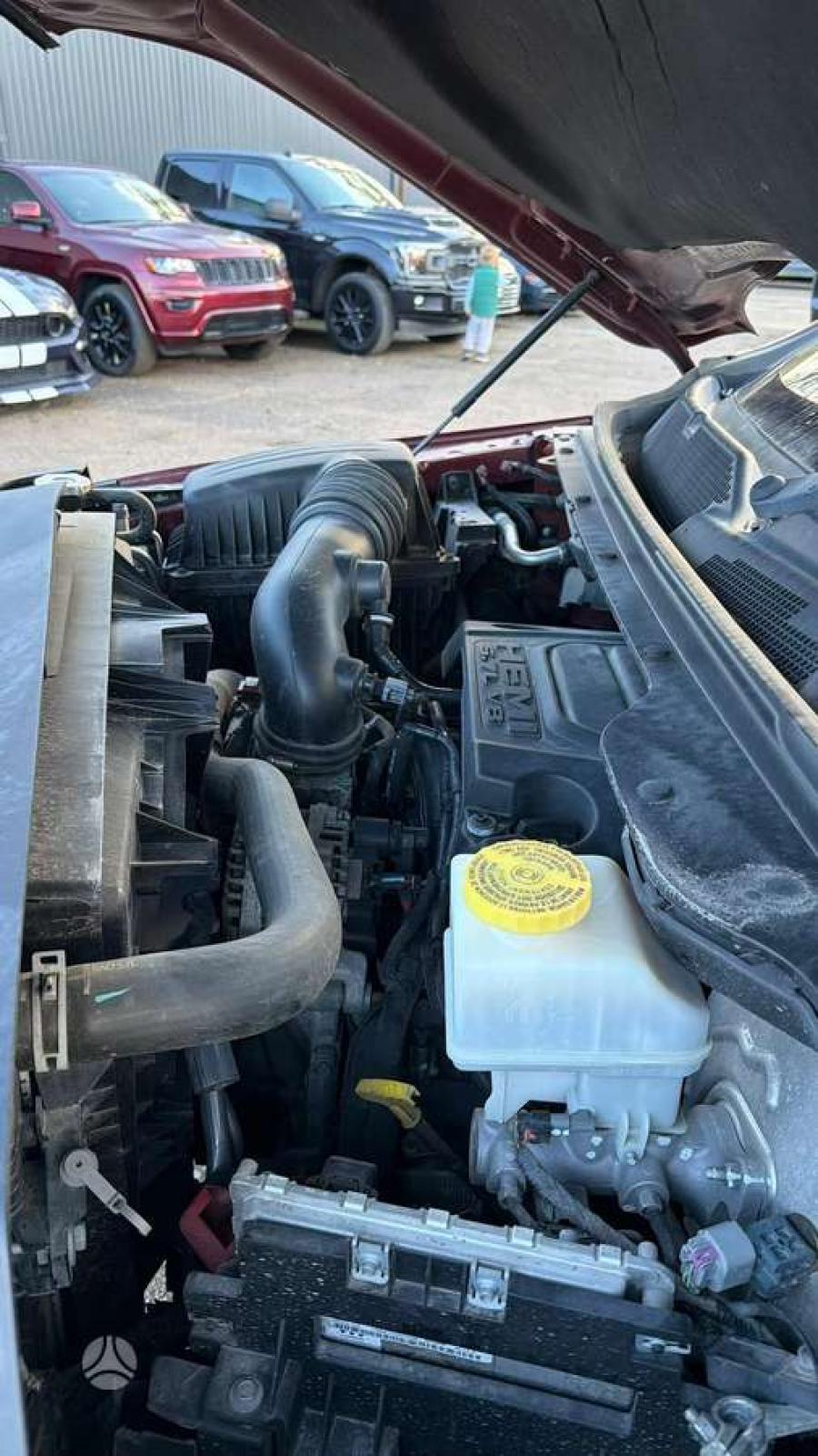 Red Dodge RAM 2019 in Ukmerge, with an engine capacity of 5.65 L and mileage of 138 thousand km for 15999 €, photo 11 on AUTOMOTO.COM.LV