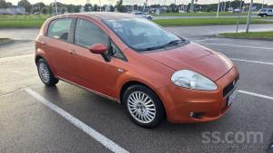 Orange Fiat Grande Punto 2006 in Riga, with an engine capacity of 1.40 L and mileage of 380 thousand km for 400 €, photo 1 on AUTOMOTO.COM.LV