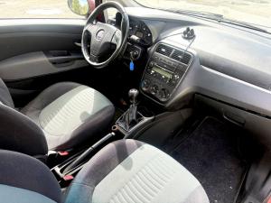 Red Fiat Punto 2007 in Tallinn, with an engine capacity of 1.40 L and mileage of 250 thousand km for 1199 €, photo 22 on AUTOMOTO.COM.LV