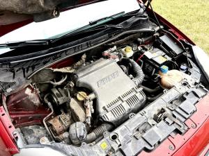 Red Fiat Punto 2007 in Tallinn, with an engine capacity of 1.40 L and mileage of 250 thousand km for 1199 €, photo 26 on AUTOMOTO.COM.LV