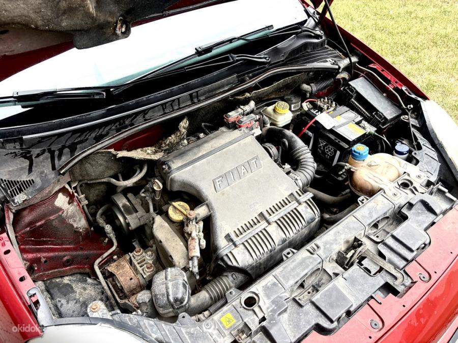 Red Fiat Punto 2007 in Tallinn, with an engine capacity of 1.40 L and mileage of 250 thousand km for 1199 €, photo 26 on AUTOMOTO.COM.LV