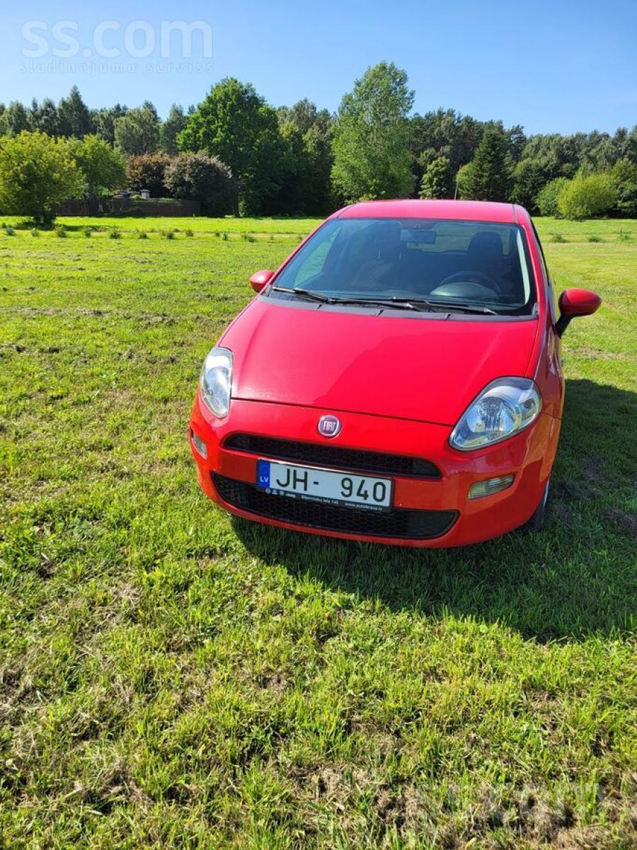 Red Fiat Punto 2013 in Riga, with an engine capacity of 1.20 L and mileage of 166 thousand km for 2100 €, photo 6 on AUTOMOTO.COM.LV