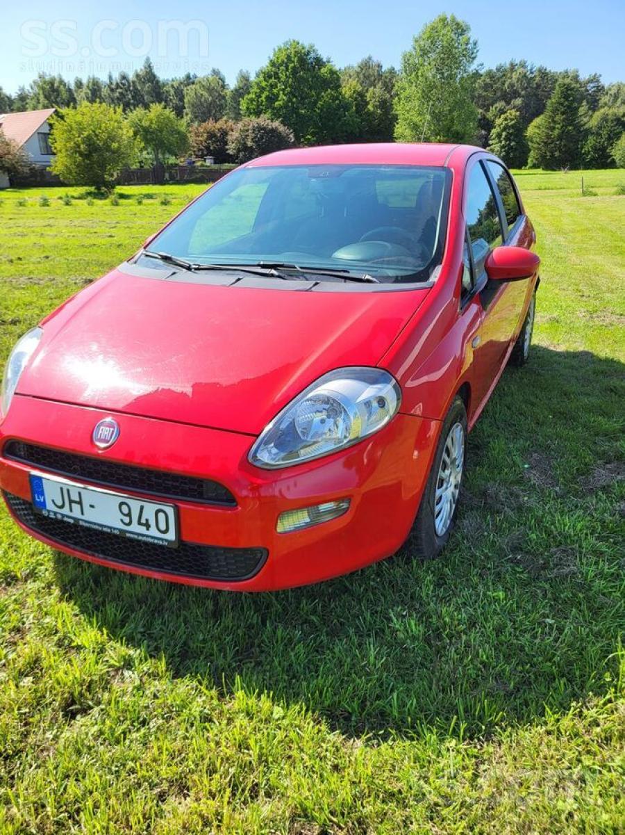 Red Fiat Punto 2013 in Riga, with an engine capacity of 1.20 L and mileage of 166 thousand km for 2100 €, photo 9 on AUTOMOTO.COM.LV
