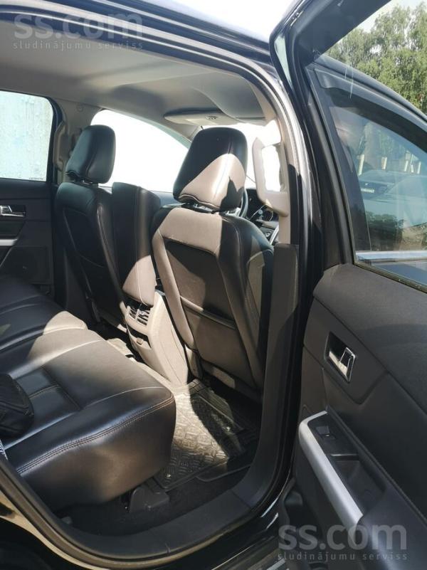 Black Ford Edge 2012 in Riga, with an engine capacity of 3.50 L and mileage of 213 thousand km for 8600 €, photo 7 on AUTOMOTO.COM.LV