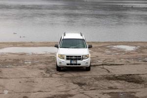 White Ford Escape 2009 in Kaunas, with an engine capacity of 2.30 L and mileage of 275 thousand km for 4900 €, photo 16 on AUTOMOTO.COM.LV