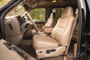 Black Ford Excursion 2002 in Jelgava, with an engine capacity of 7.00 L and mileage of 128 thousand km for 27000 €, photo 20 on AUTOMOTO.COM.LV