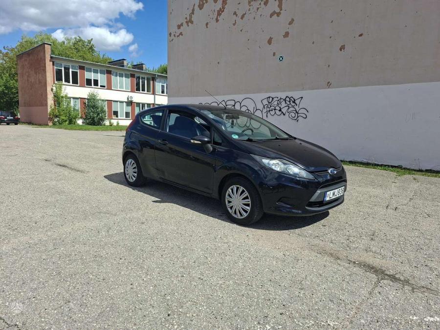 Black Ford Fiesta 2009 in Panevezys, with an engine capacity of 1.24 L and mileage of 223 thousand km for 1400 €, photo 1 on AUTOMOTO.COM.LV