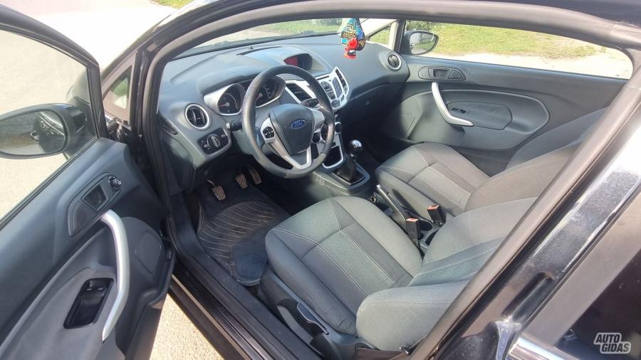 Black Ford Fiesta 2009 in Kaunas, with an engine capacity of 1.40 L and mileage of 165 thousand km for 1750 €, photo 6 on AUTOMOTO.COM.LV