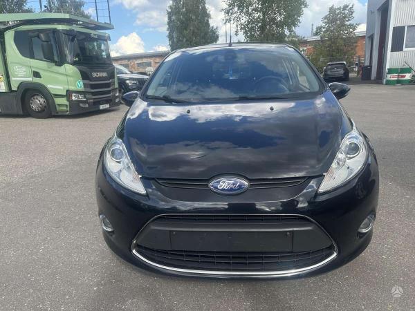 Black Ford Fiesta 2012 in Ukmerge, with an engine capacity of 1.40 L and mileage of 250 thousand km for 2350 €, photo 1 on AUTOMOTO.COM.LV
