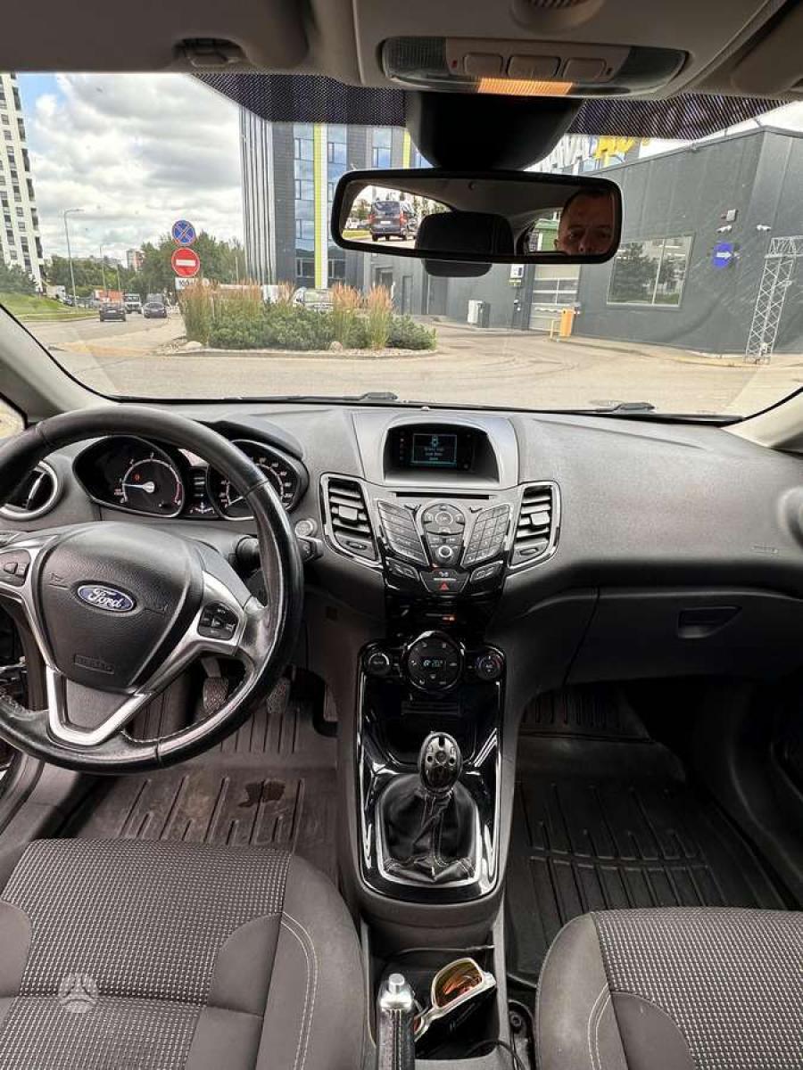 Black Ford Fiesta 2015 in Vilnius, with an engine capacity of 1.50 L and mileage of 262 thousand km for 2200 €, photo 12 on AUTOMOTO.COM.LV