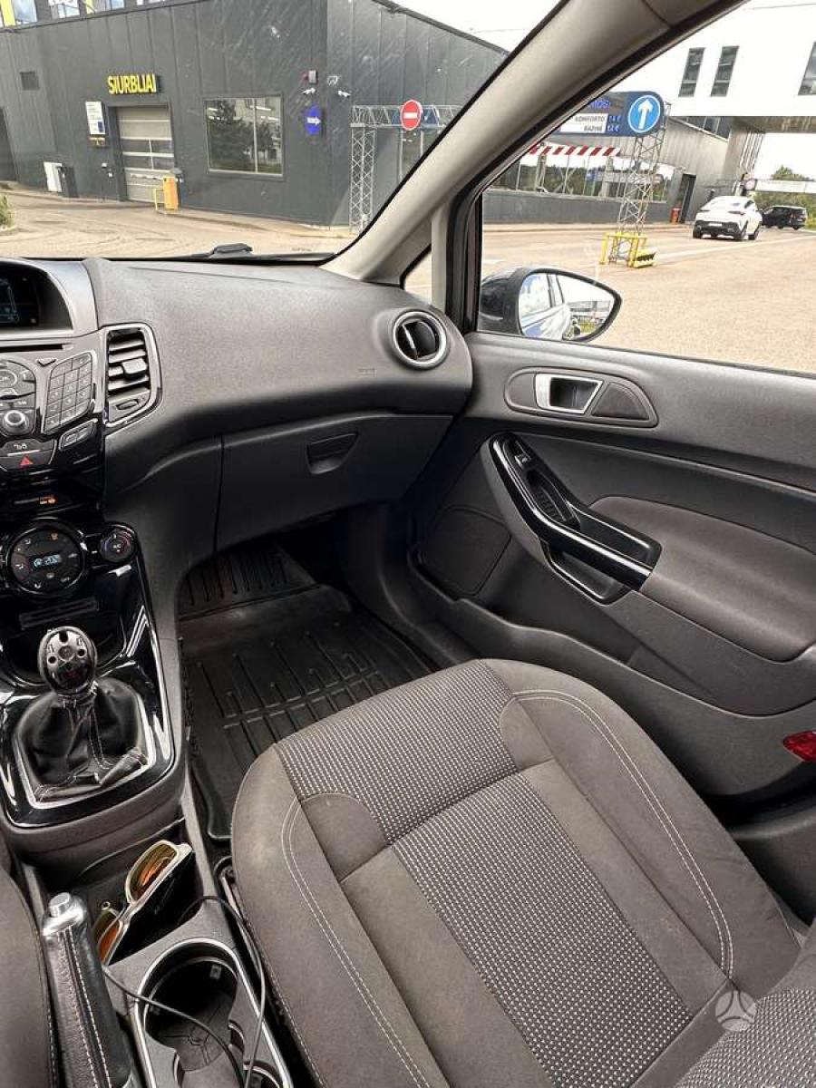Black Ford Fiesta 2015 in Vilnius, with an engine capacity of 1.50 L and mileage of 262 thousand km for 2200 €, photo 14 on AUTOMOTO.COM.LV