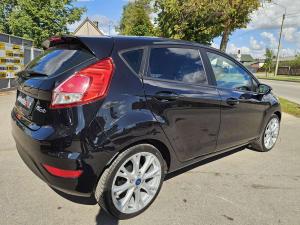 Black Ford Fiesta 2015 in Siauliai, with an engine capacity of 1.00 L and mileage of 228 thousand km for 5450 €, photo 6 on AUTOMOTO.COM.LV